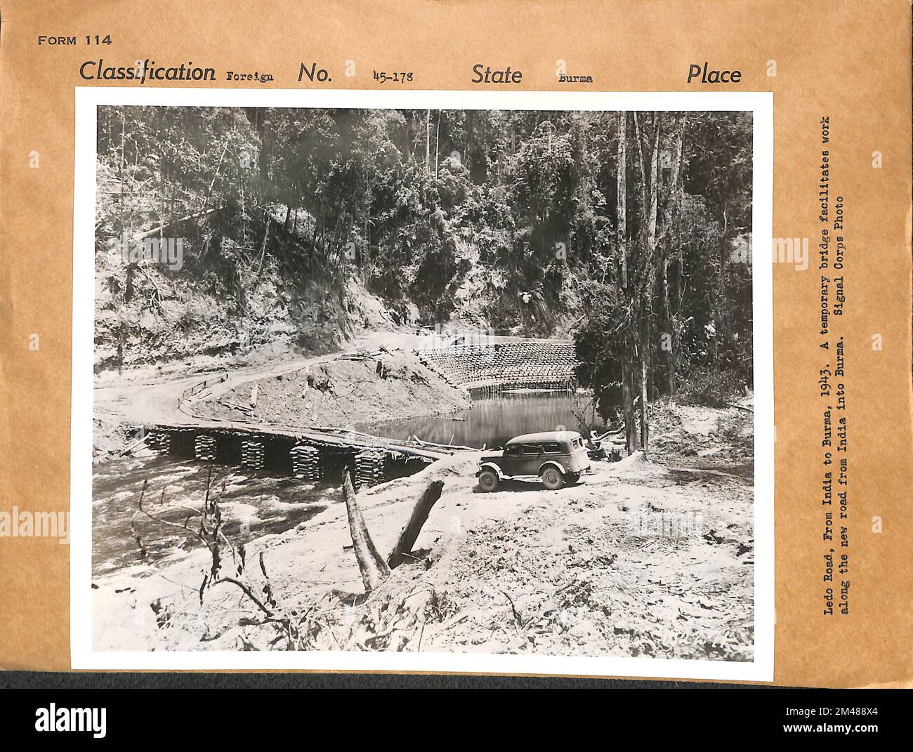Ledo Road from India to Burma. Original caption: A temporary bridge ...