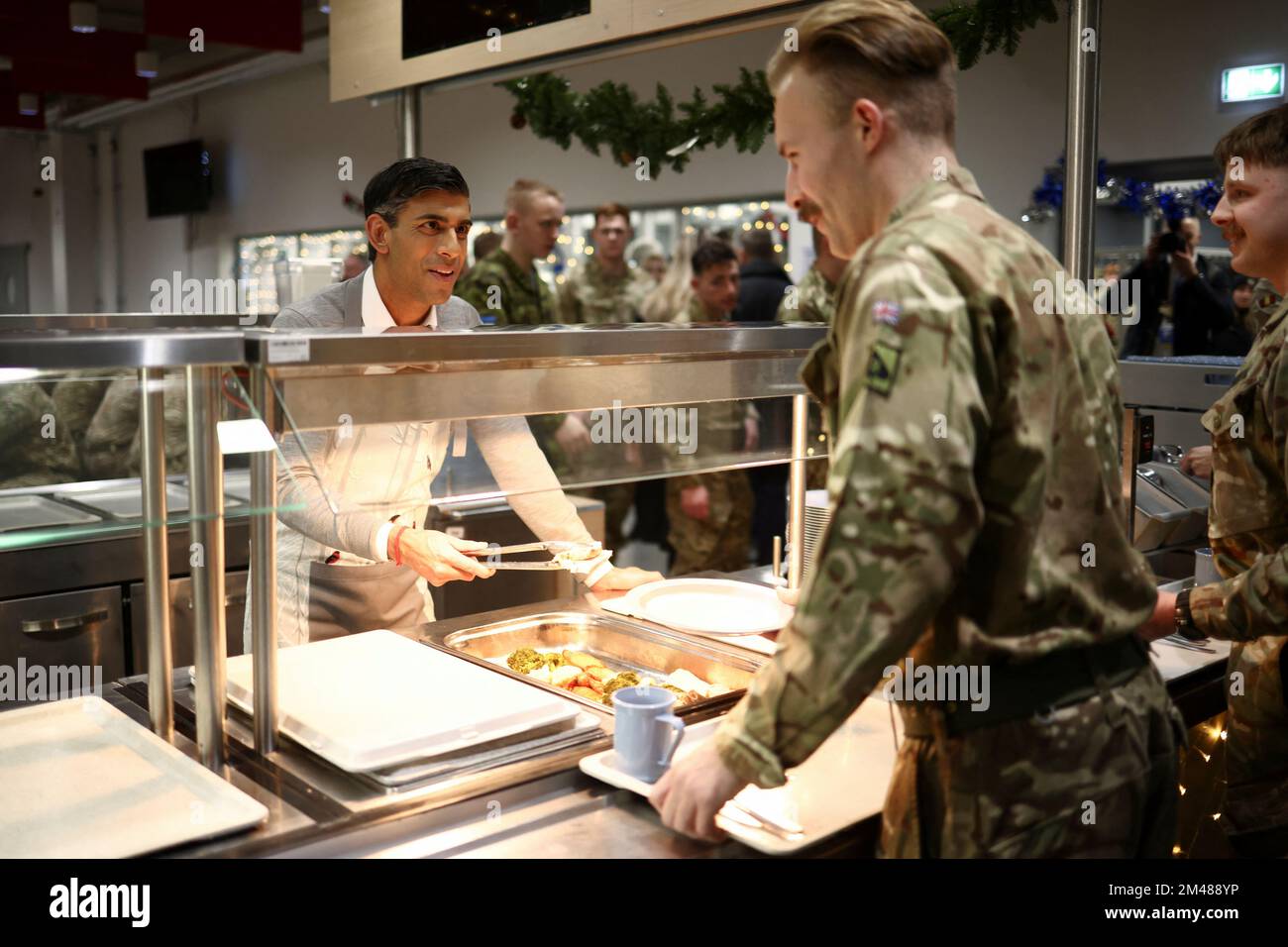 Prime Minister Rishi Sunak serves Christmas dinner to troops at the ...