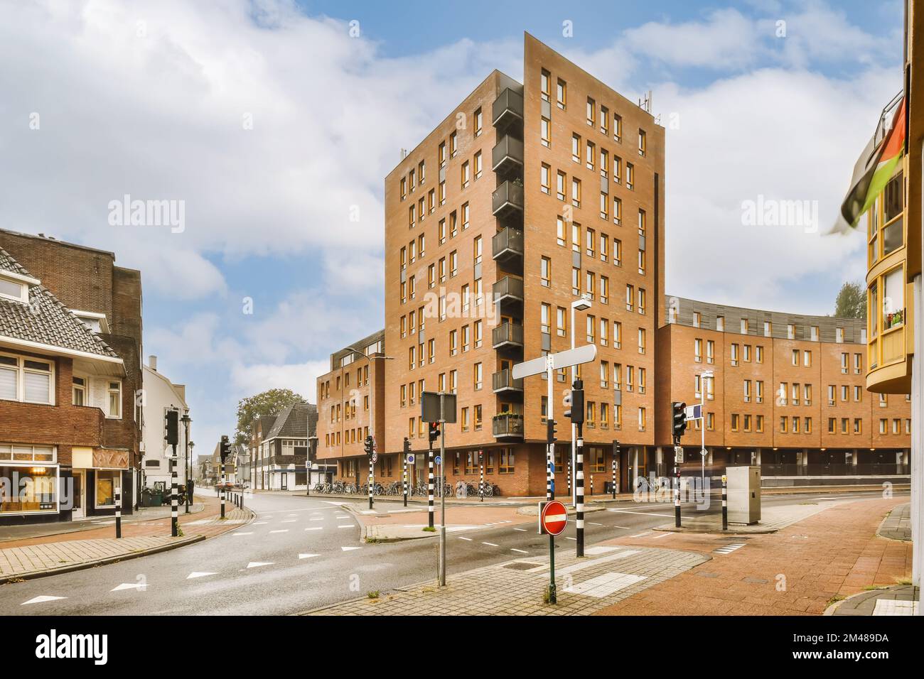 a city street with buildings on both sides and a stop sign in the ...