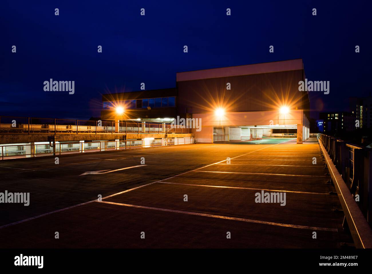 multi story car park at night Stock Photo - Alamy