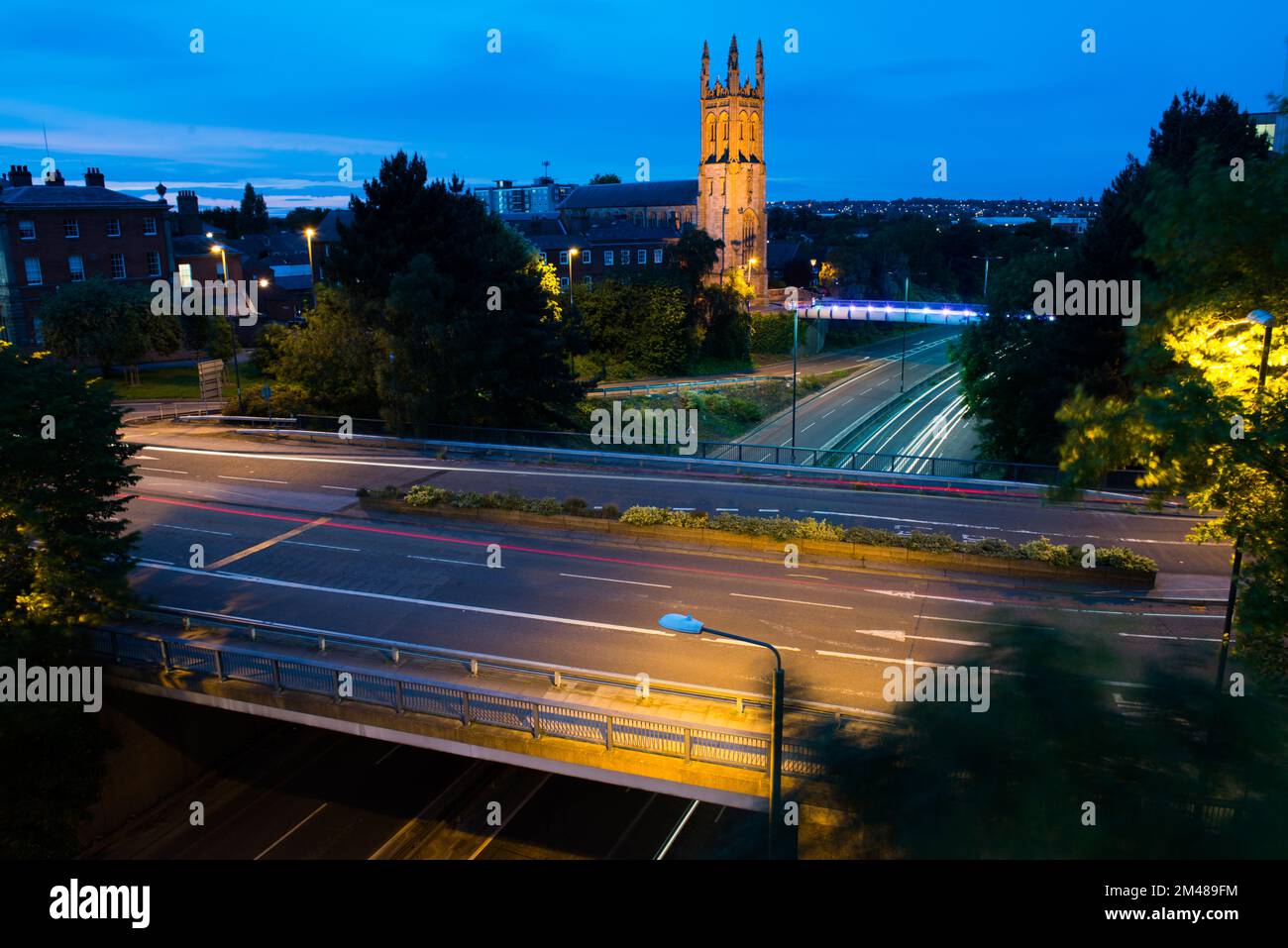 Night time in derby England with roads and st Marys church in the ...