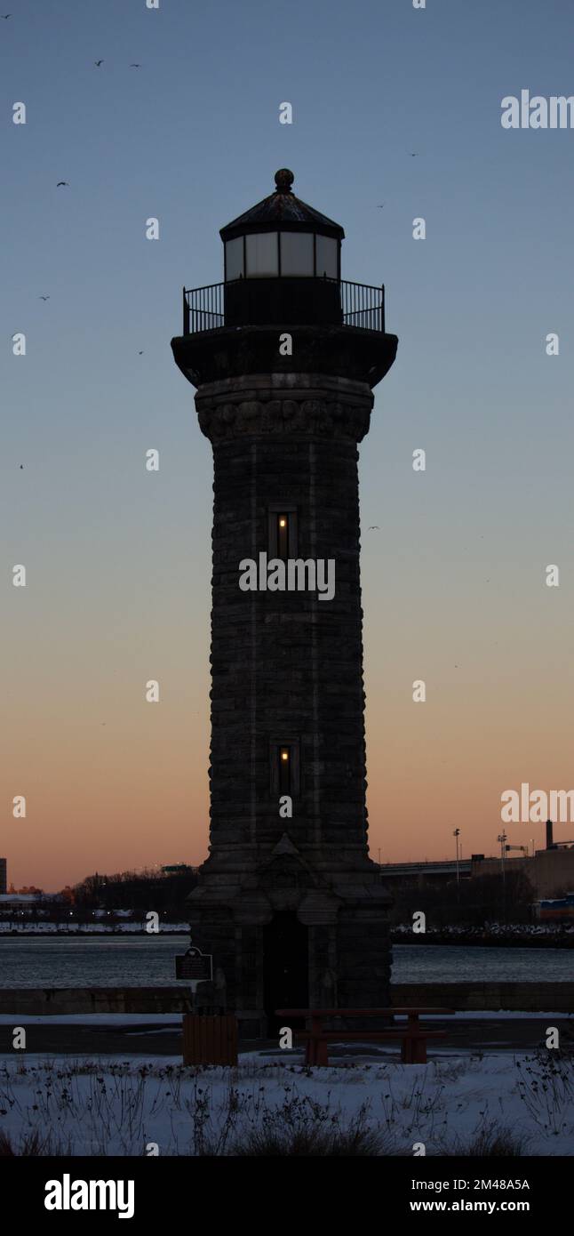 A vertical shot of a lighthouse during a sunset Stock Photo - Alamy