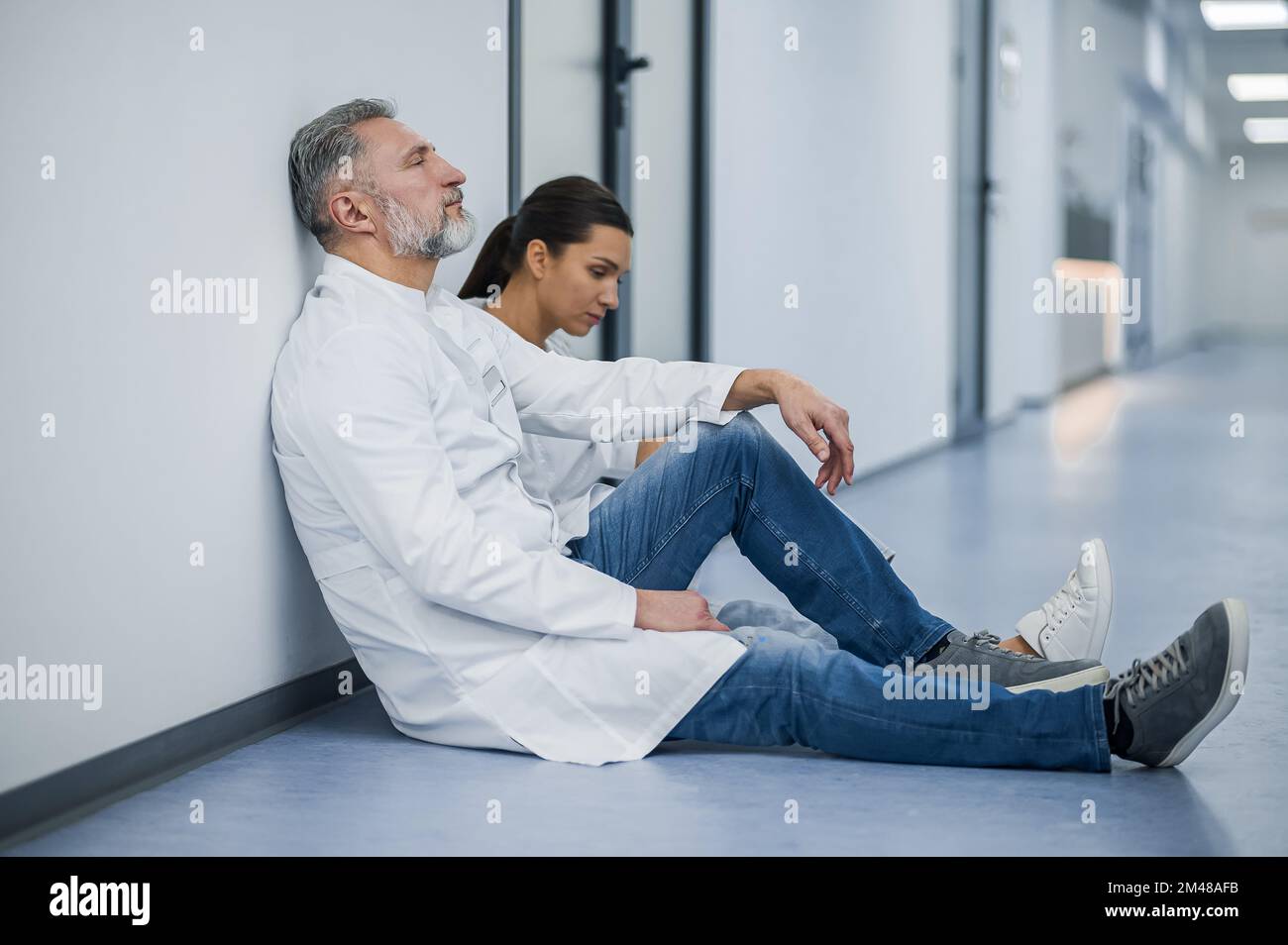 Doctors feeling exhausted after the hard shift Stock Photo - Alamy Doctors feeling exhausted after the hard shift Stock Photo - Alamy