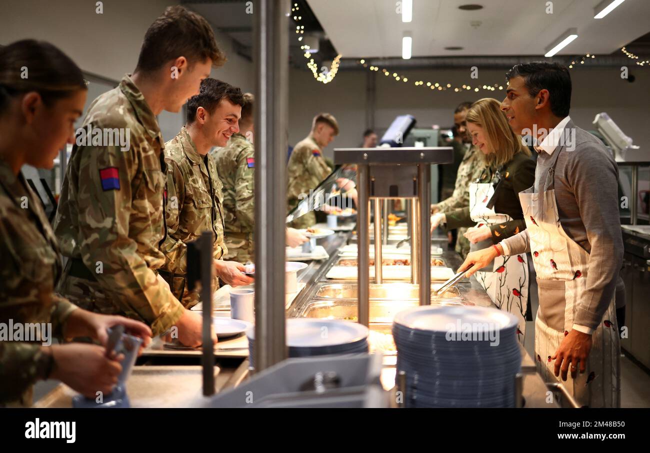Prime Minister Rishi Sunak serves Christmas dinner to troops with ...