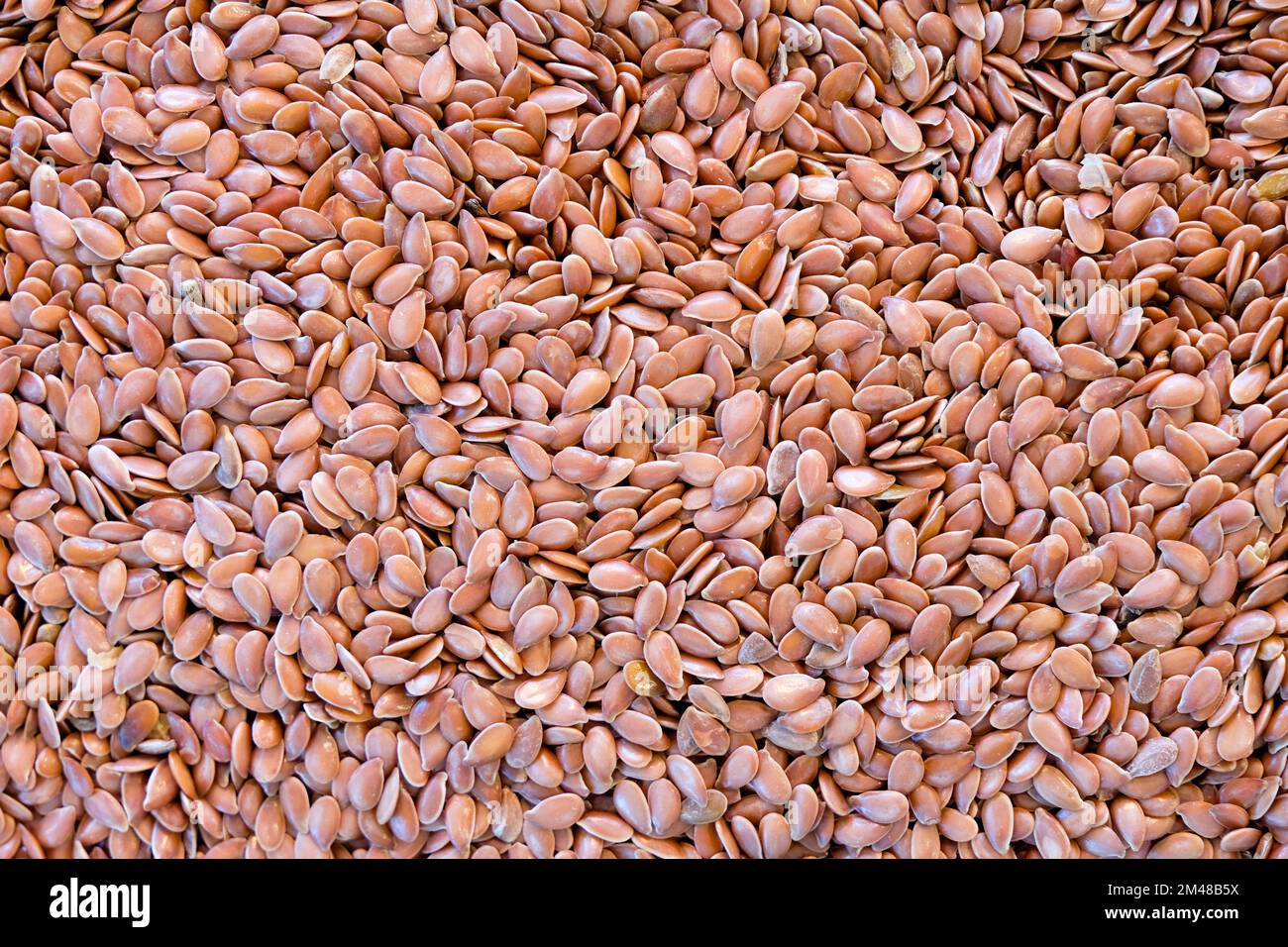 Whole flaxseed in mass and ready to be used Stock Photo - Alamy