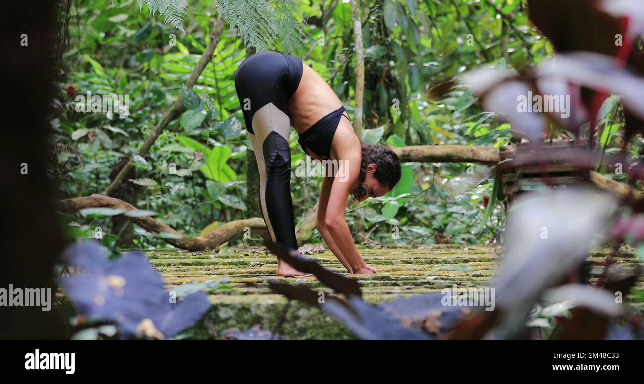 Yogi woman stretching legs hi-res stock photography and images - Alamy