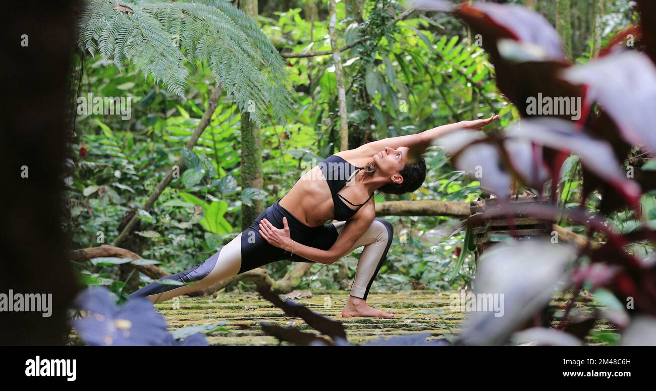 Yogi woman practicing Yoga strength pose outdoors Stock Photo - Alamy