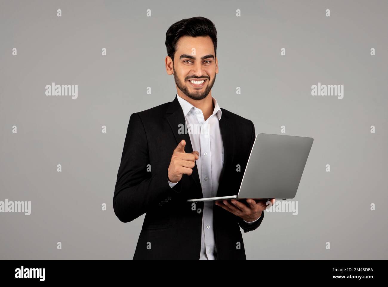 Arab businessman laptop smiling camera hi-res stock photography and ...