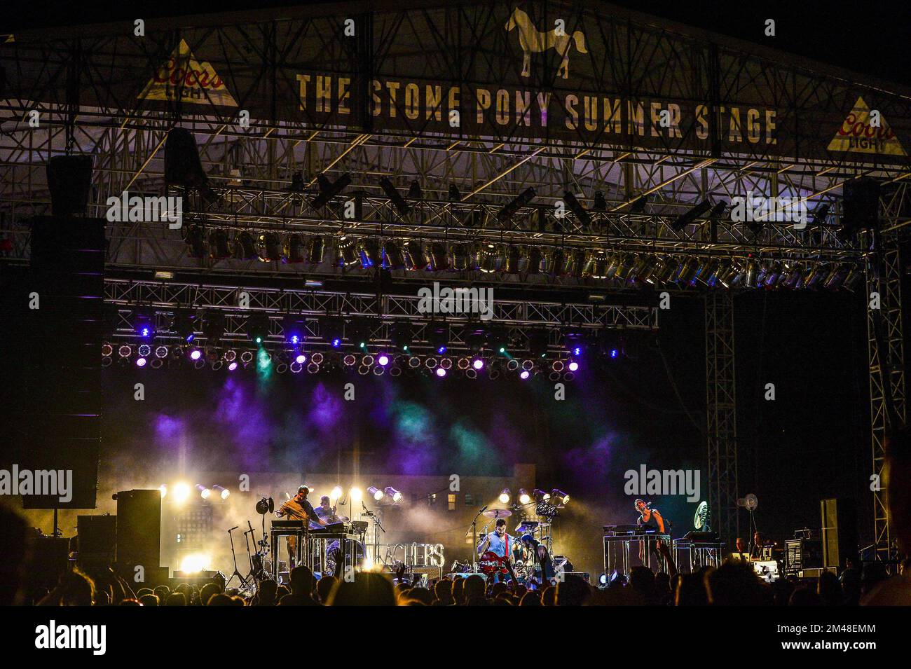 Shadow of the City - Bleachers in concert Stock Photo - Alamy