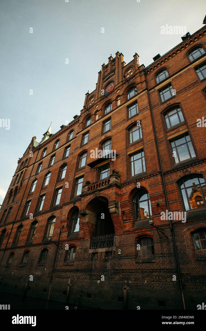 A vertical low angle shot of a historic brick building exterior in ...