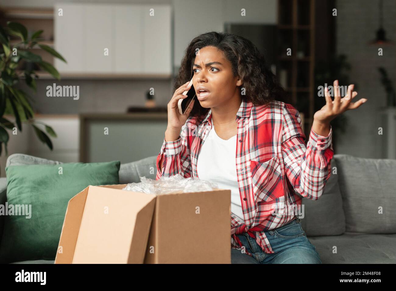 Shocked angry upset millennial black lady call by phone, arguing with ...