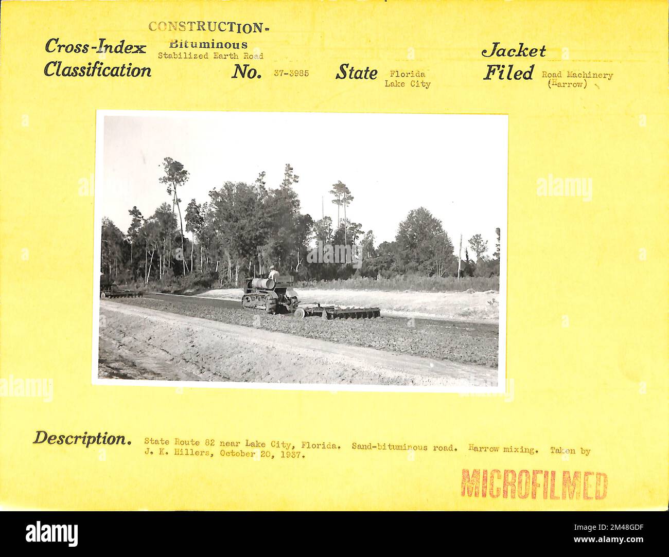 Harrow Mixing Sand-Bituminous Road on Route 82 Near Lake City, Florida ...
