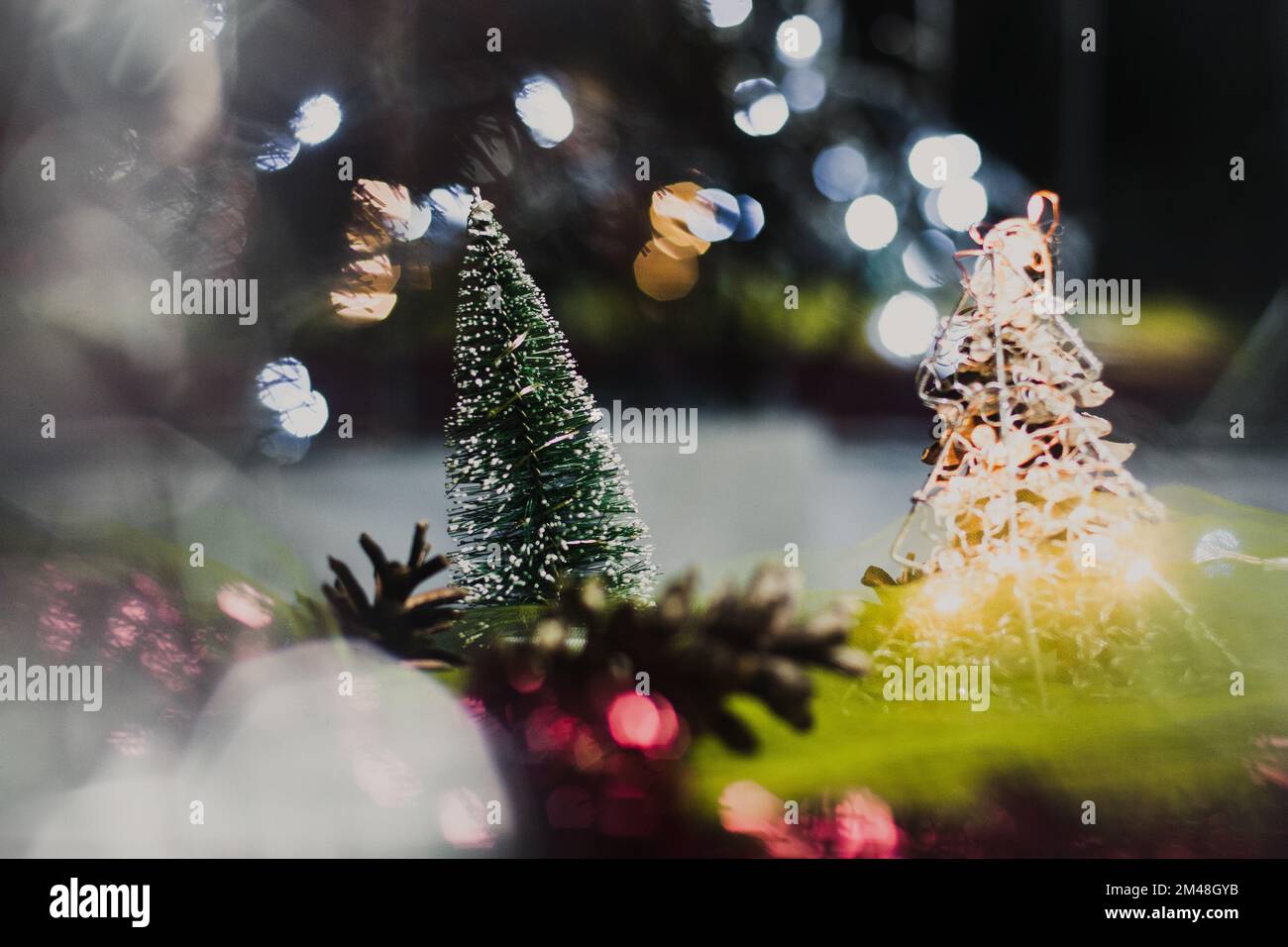 Christmas and New Year's card with a small artificial green tree and ...