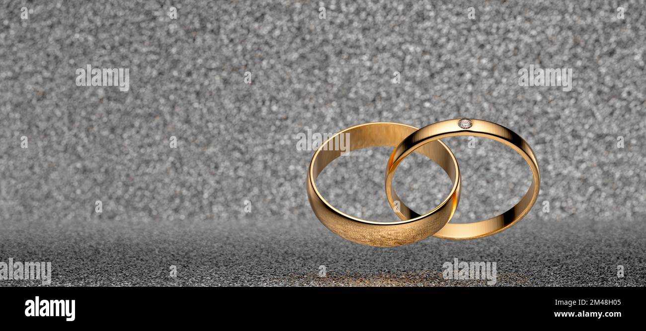 Rings threaded into each other. golden wedding rings for the wedding of ...