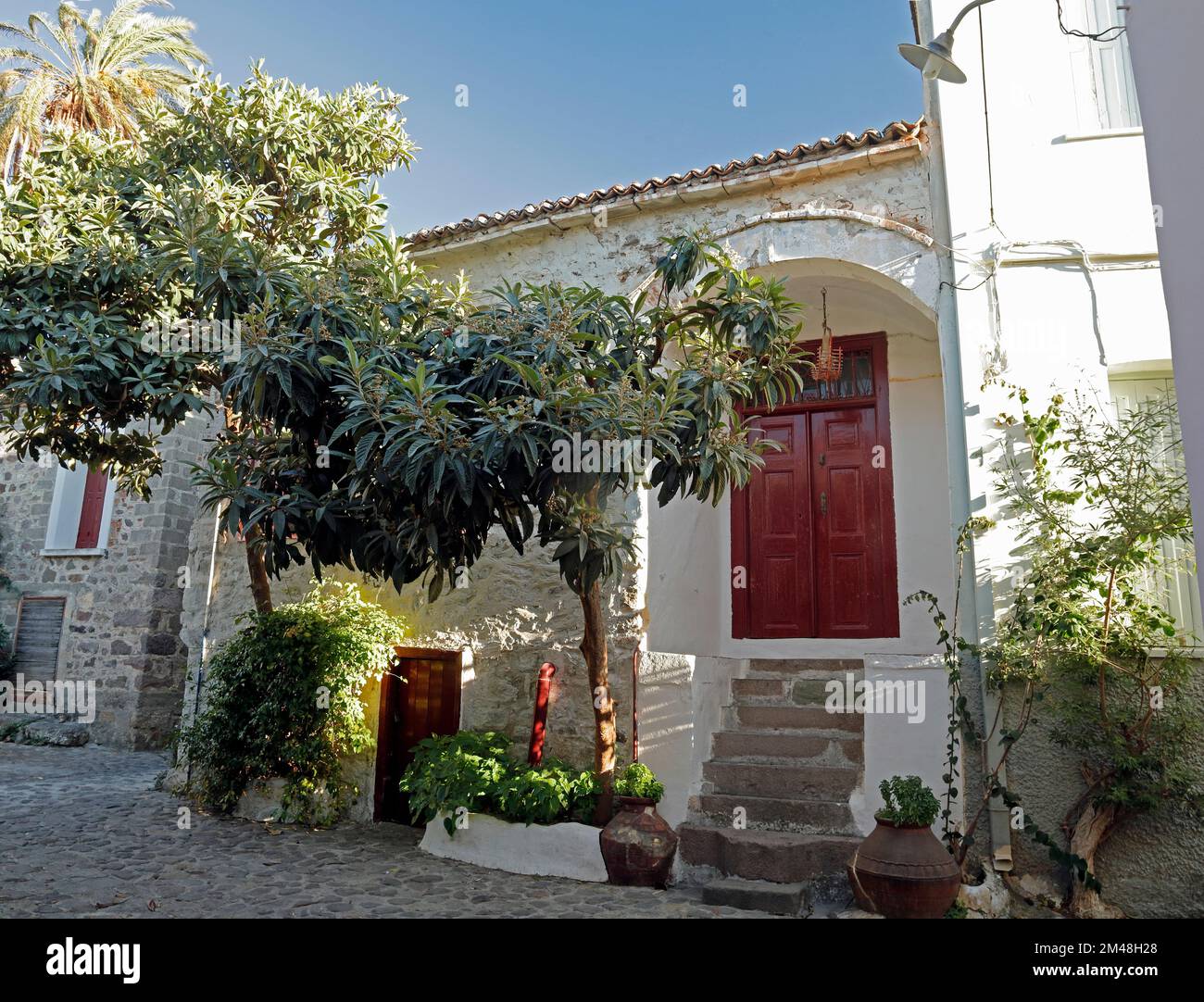 A well maintained traditional style house in a small, cobbled courtyard ...