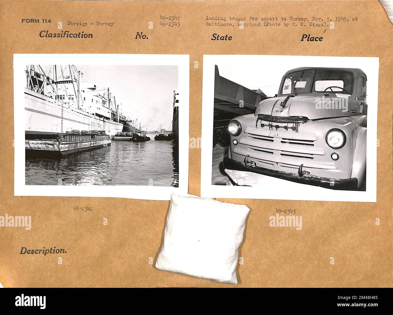 Loading trucks bound for Turkey in Baltimore. Original caption: Loading ...