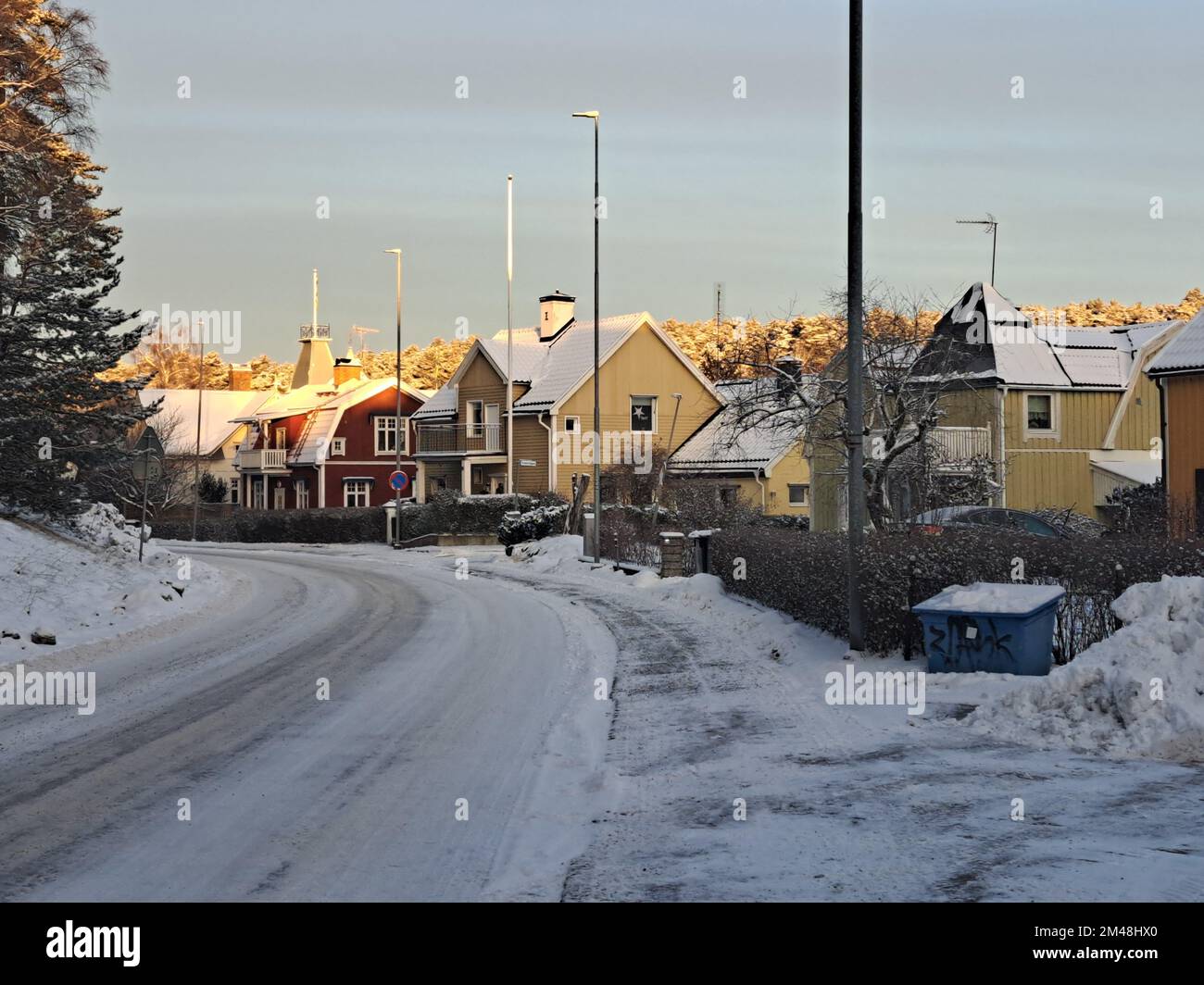 A road and houses covered in snow on the sunrise Stock Photo - Alamy