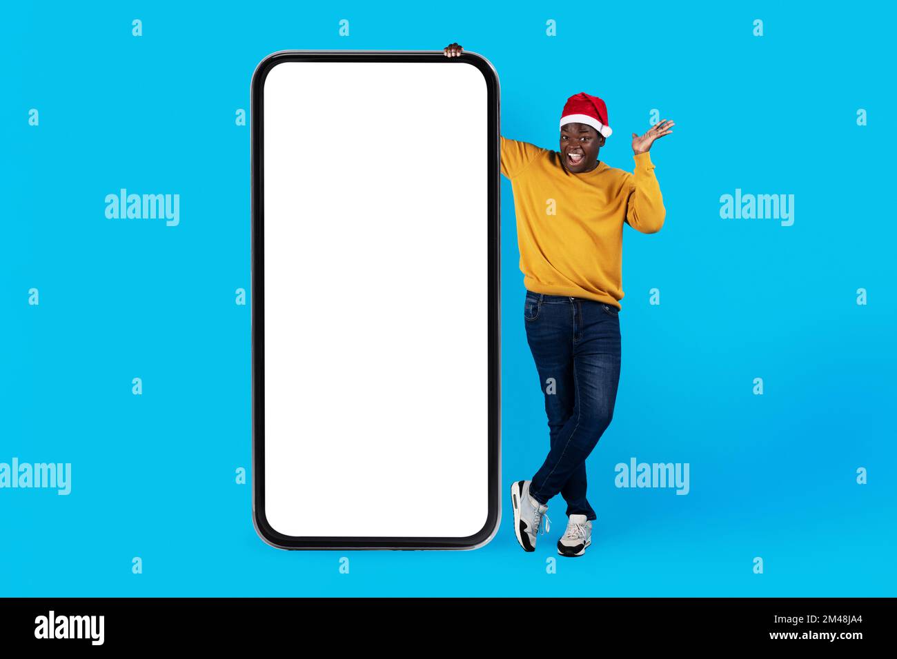 Holiday Promo. Excited Black Man In Santa Hat Standing Near Blank ...