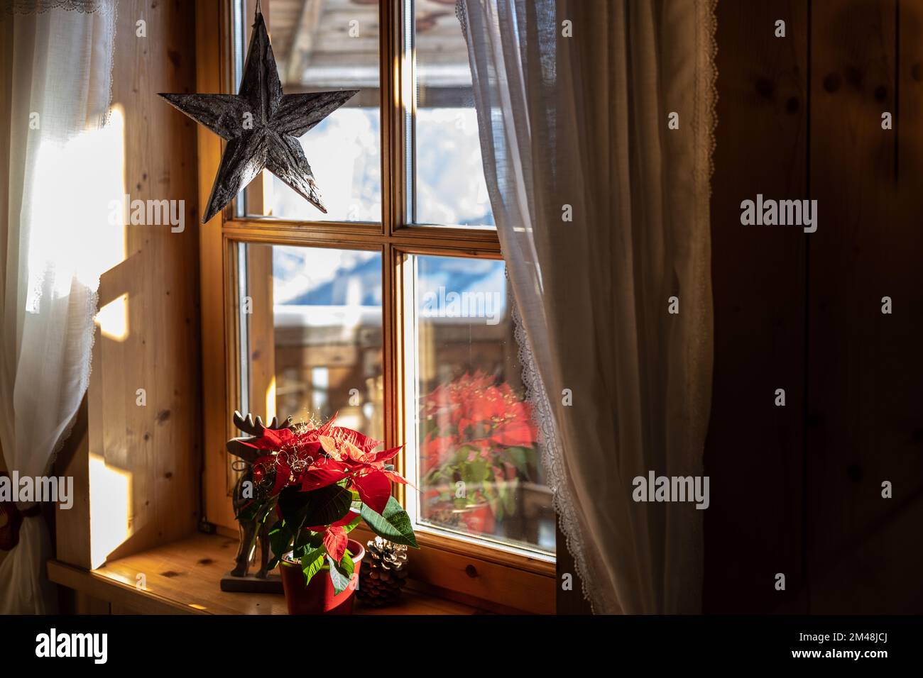 Window with wooden frame, decoration and flower overlooking the ...