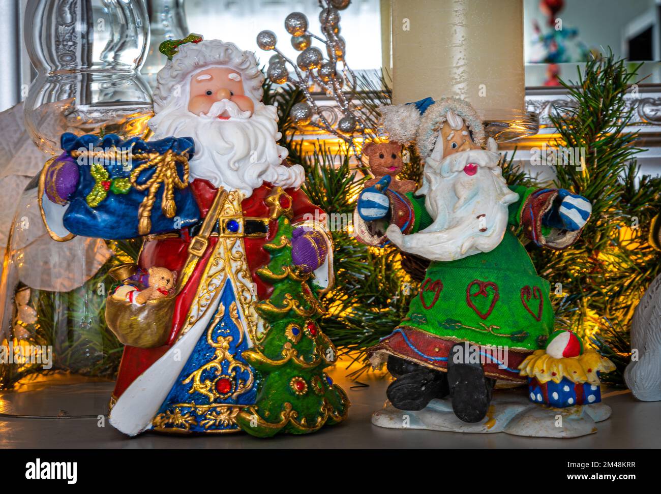 Christmas decorations. Santa Claus on the fireplace among other ...