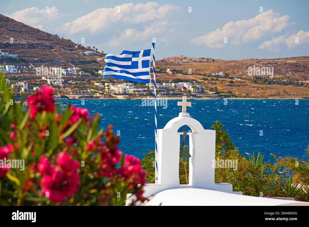 Greek seaside island Mykonos coast landscape with flag and religious ...