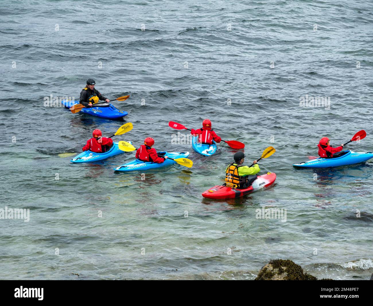 Schoolchildren having kayaking lessons Elgol, Isle of Skye, Scotland ...