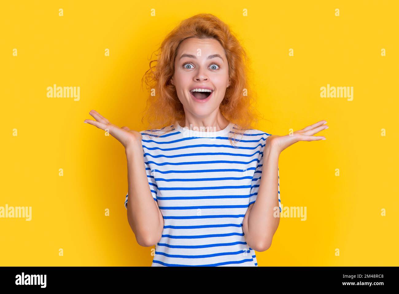 amazed redhead girl face isolated on yellow background. face of young ...