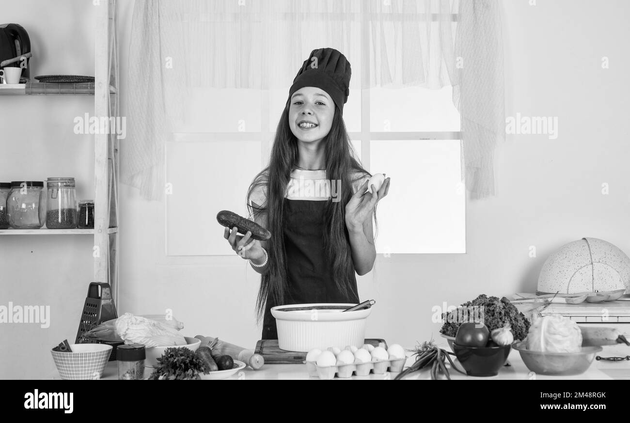 Food in your budget. kid chef cooking with cucumber and egg. child ...