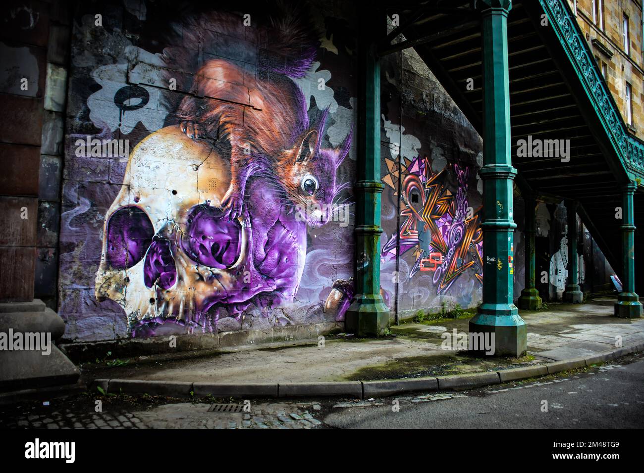 A graffiti of a skull and a squirrel under the Kelvinbridge bridge in ...