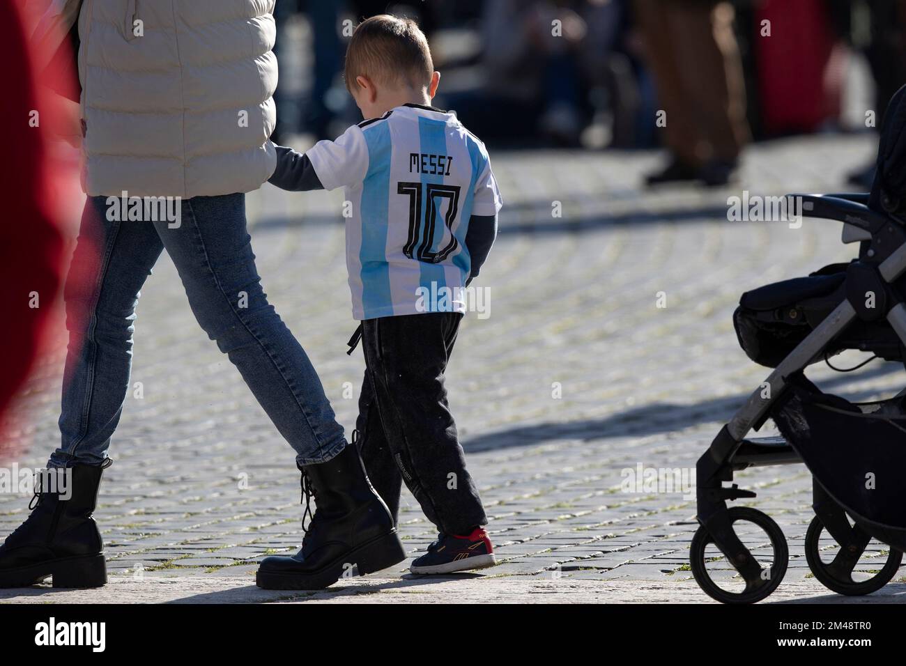 A children with a Lionel Messi jersey before Pope Francis exits from ...