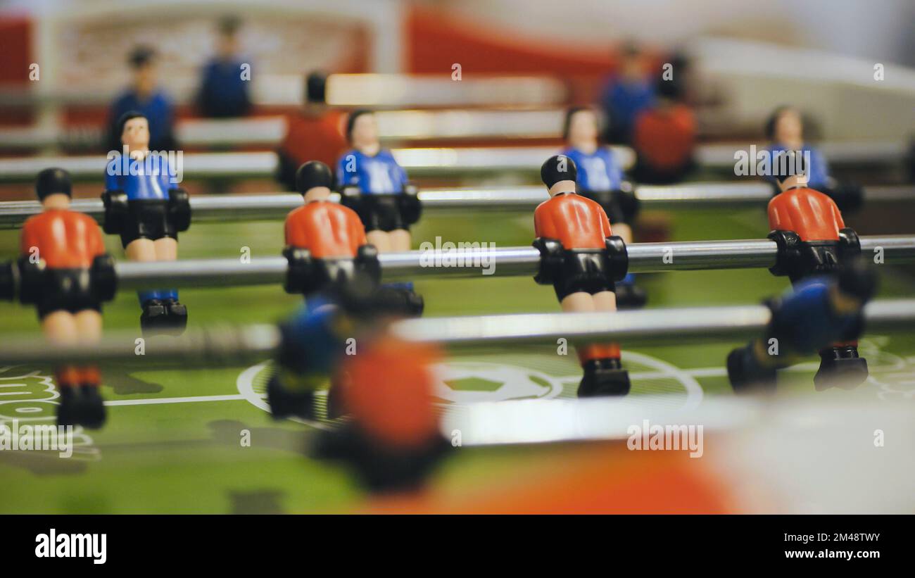 Players play table football in the clubhouse Stock Photo - Alamy