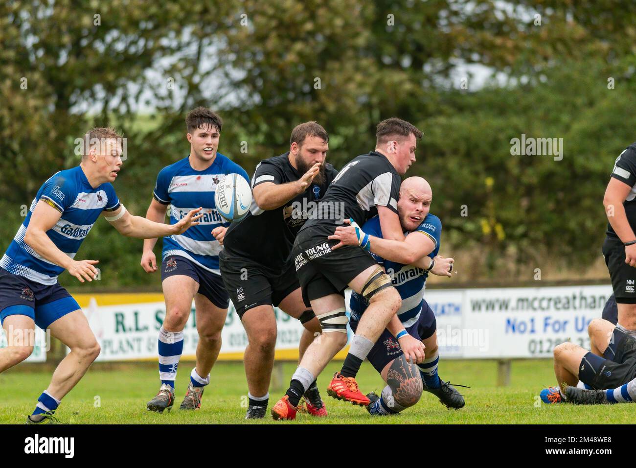 Howe of Fife player makes a strong tackle knocking the ball from the ...