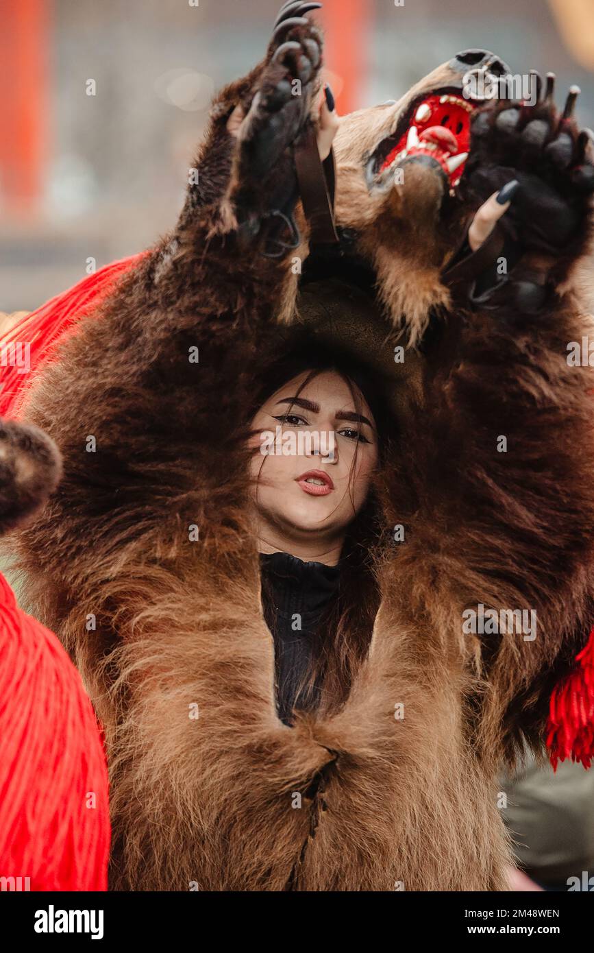 A Vertical Shot Of A Young Woman Wearing A Bear Costume For The