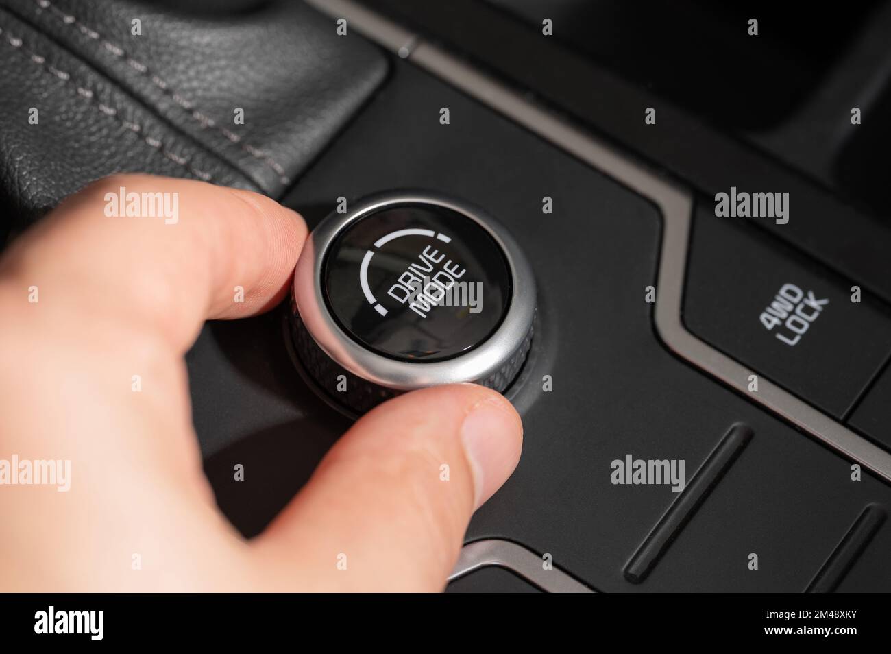 Changing driving mode in car close up view Stock Photo - Alamy
