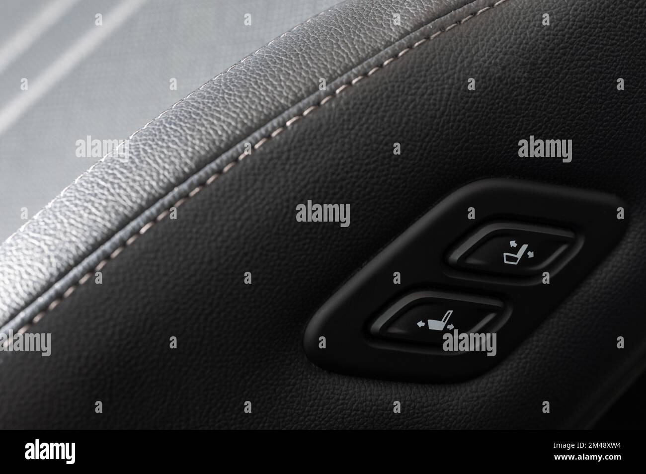 Car seat adjustment buttons on leather chair close up view Stock Photo ...