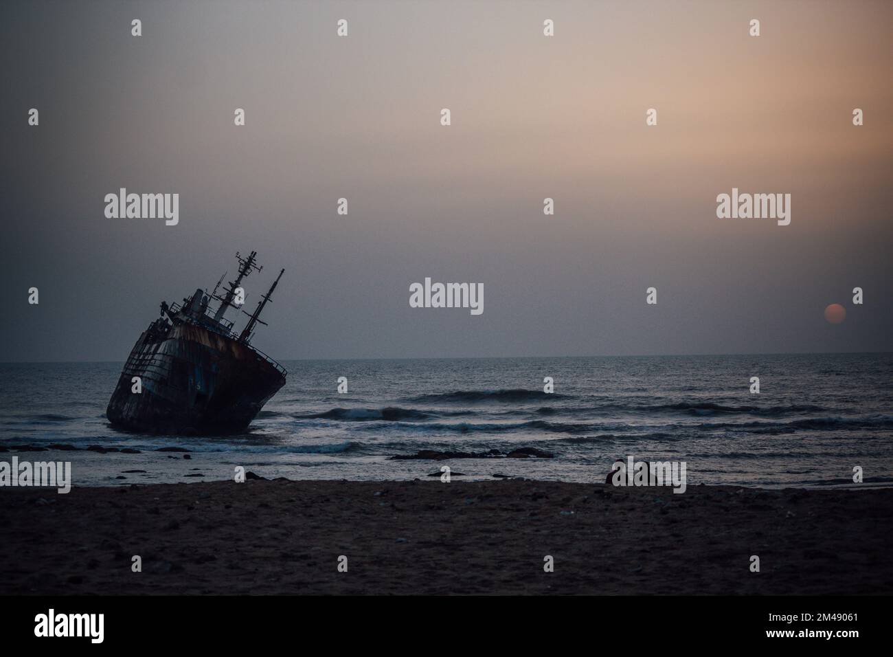A beautiful shot of a historic dirty old ship after a shipwreck on a ...