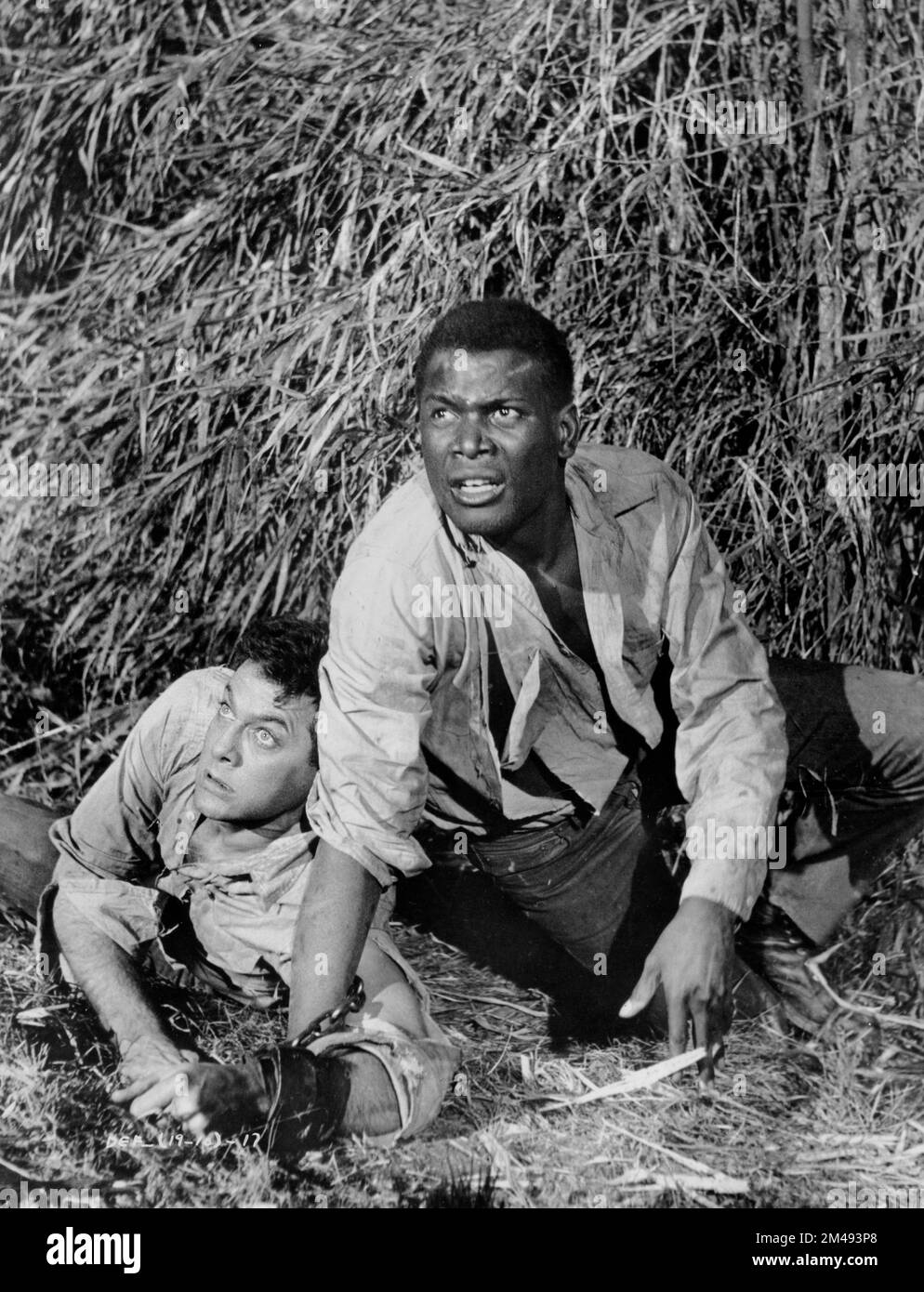 Tony Curtis, Sidney Poitier, on-set of the Film, "The Defiant Ones ...