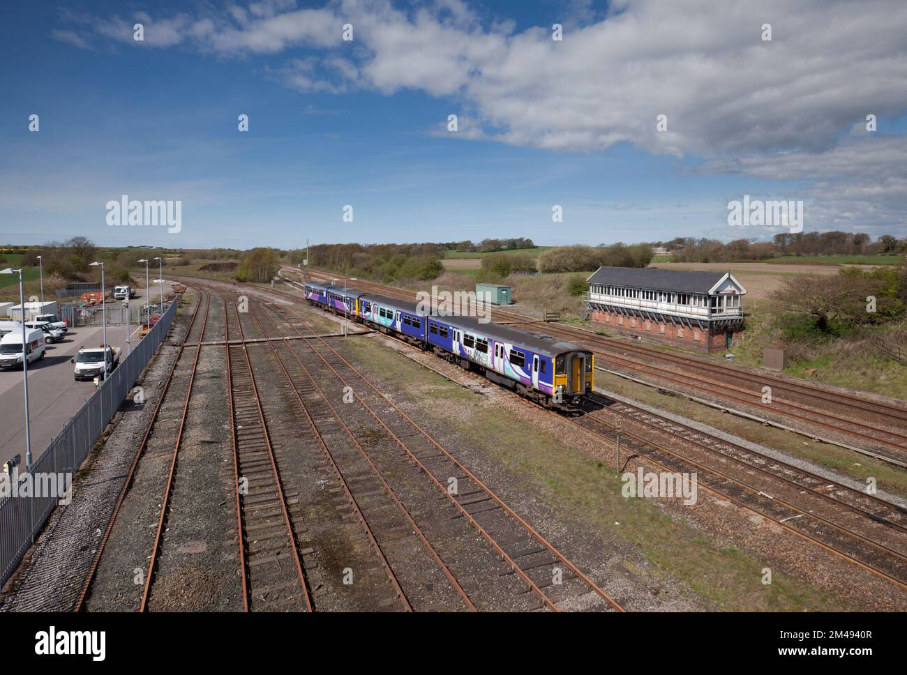 Northern Rail class 150 + class 142 diesel trains passing the mechanical signal box at Kirkham ...