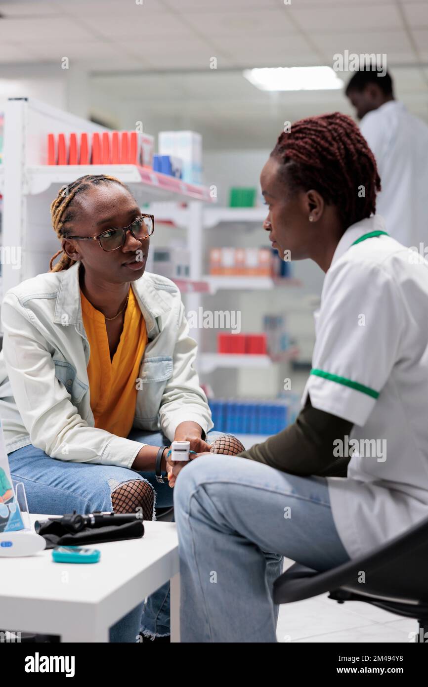 Pharmacist consultation, measuring patient oxygen saturation with pulse ...