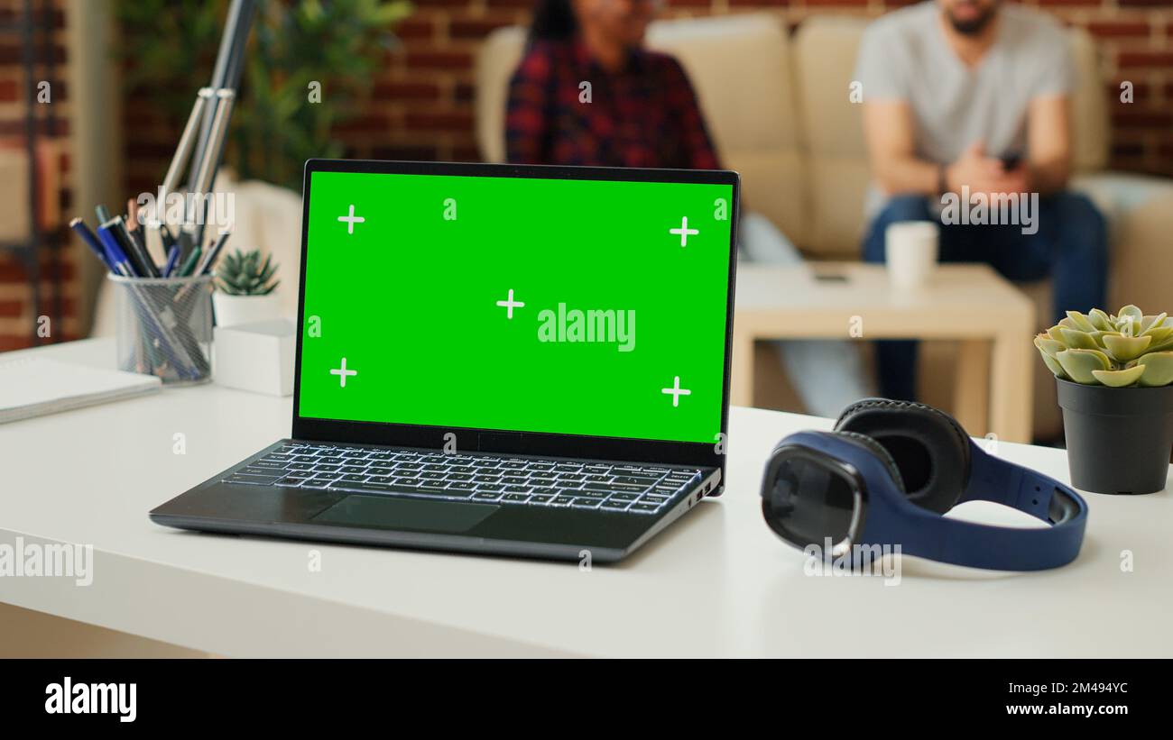 Empty office desk with laptop and isolated greenscreen template, using ...