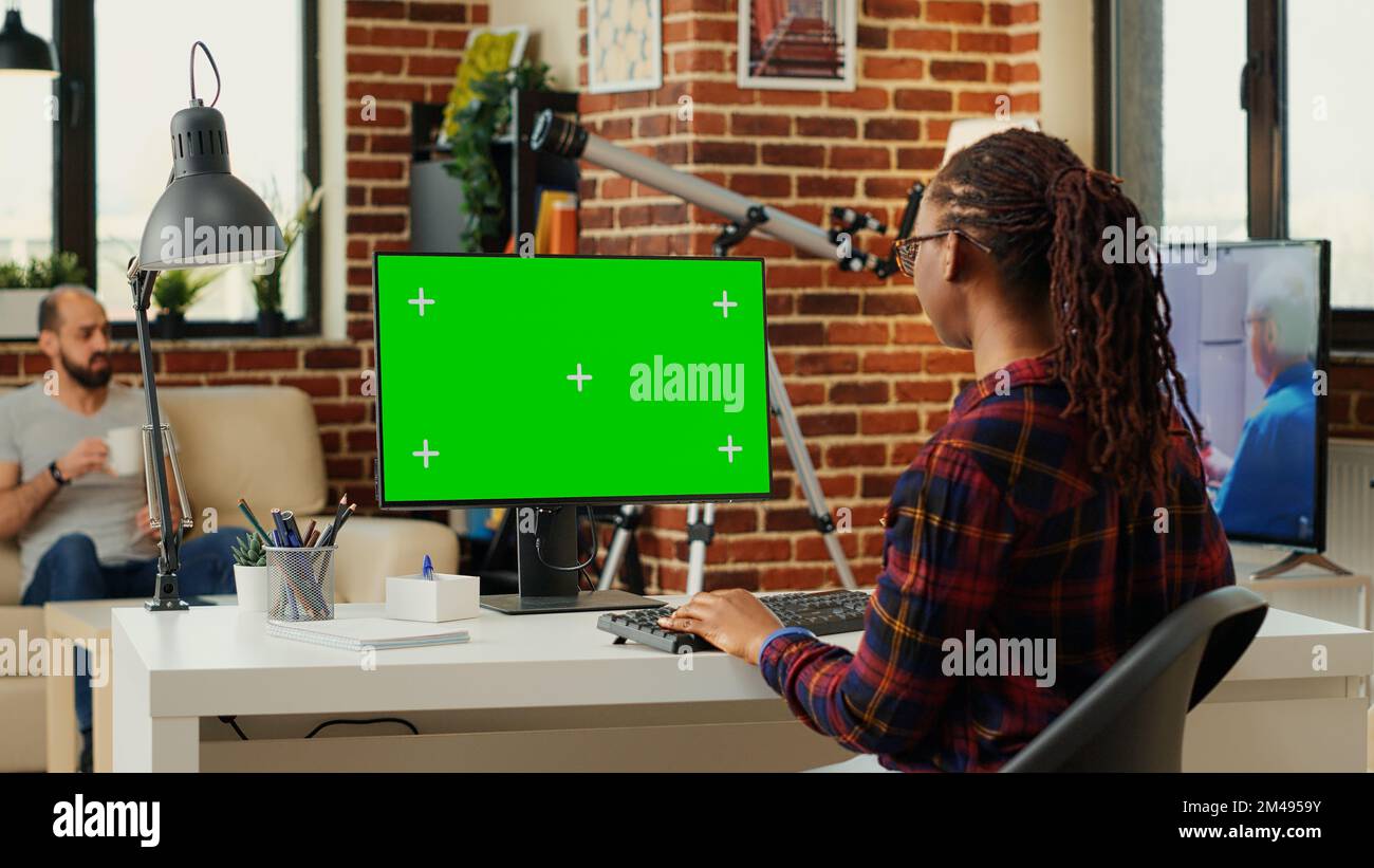 Office worker analyzing isolated greenscreen template on personal ...