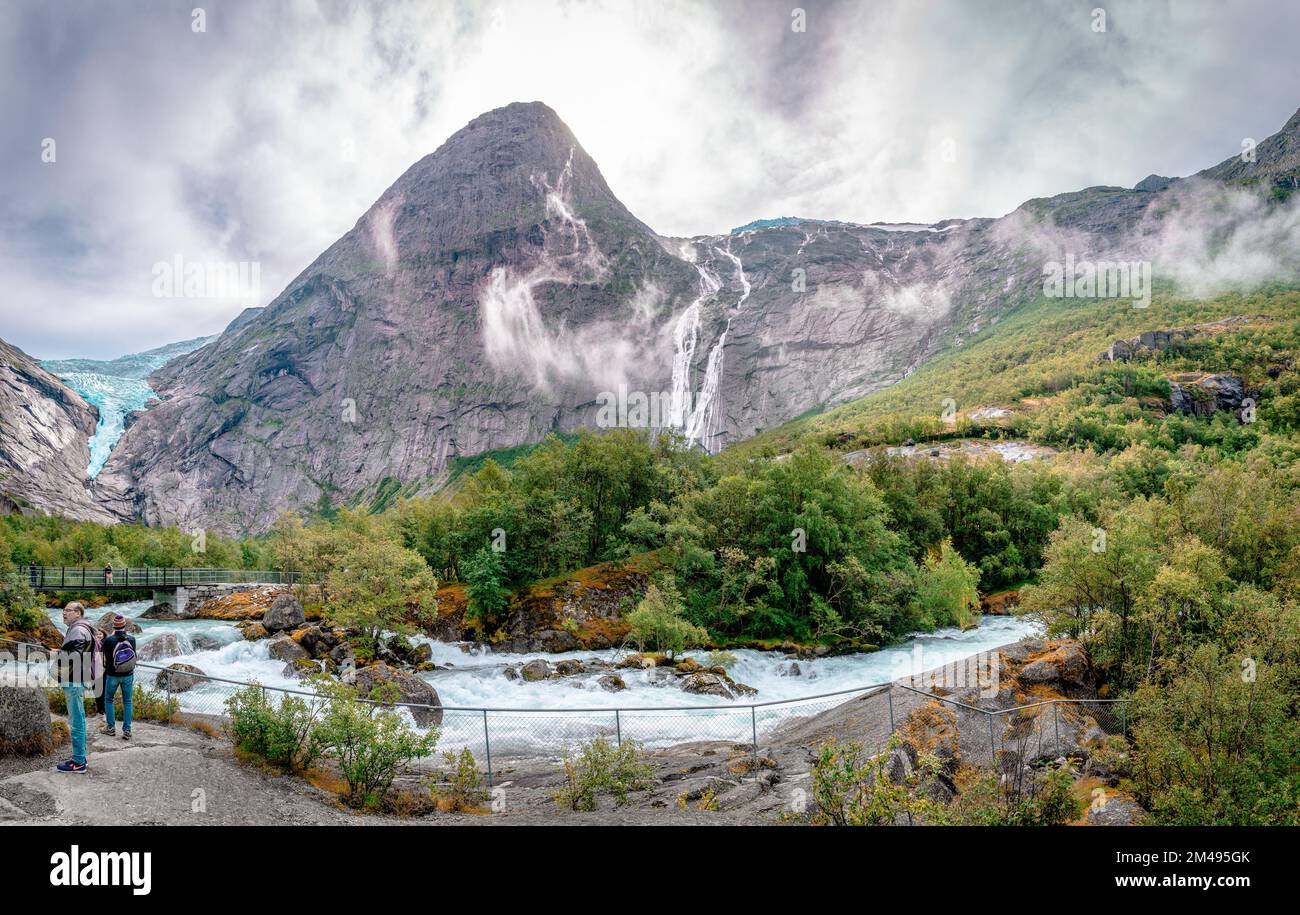 The Briksdalselva river with the footbridge and the Briksdalsbreen (the ...