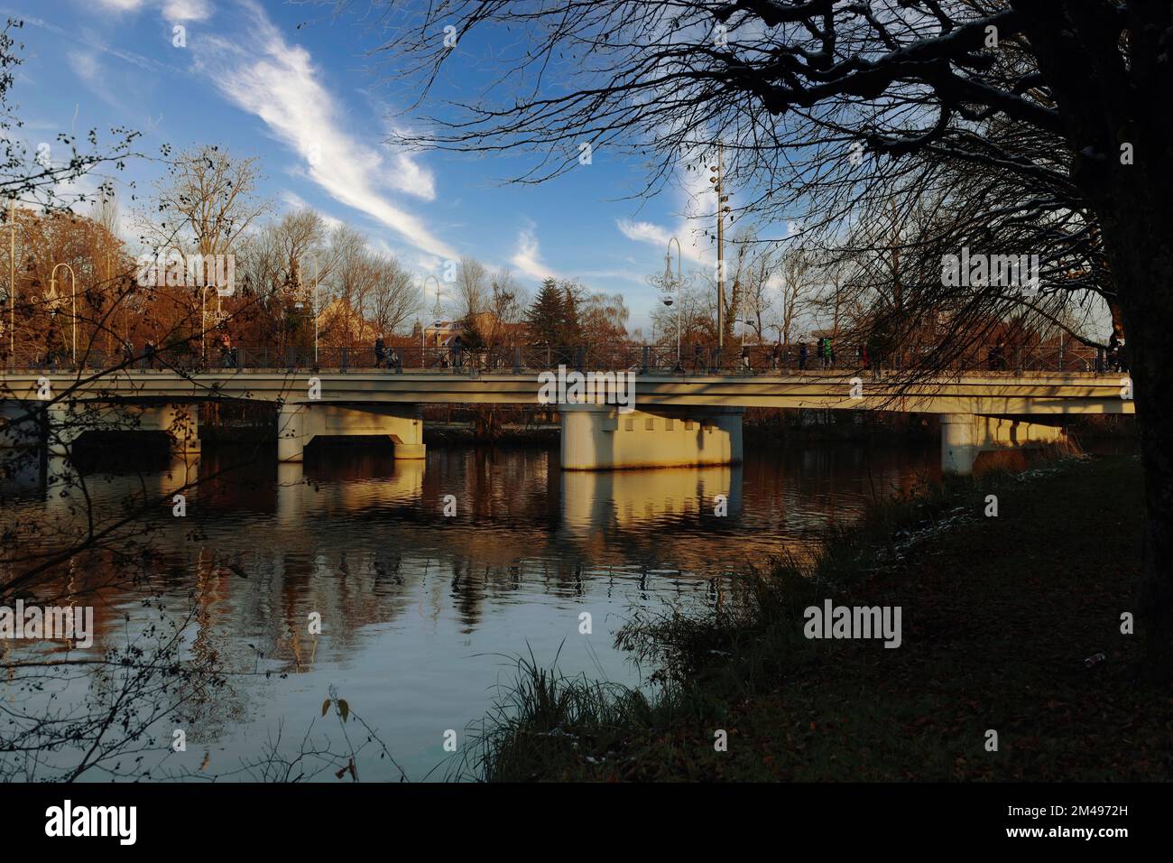 A daytime view of a bridge over a river with walkways on it Stock Photo ...
