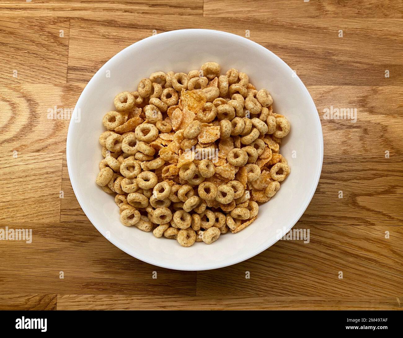 bowl of breakfast cereal on wooden kitchen table, top view Stock Photo ...