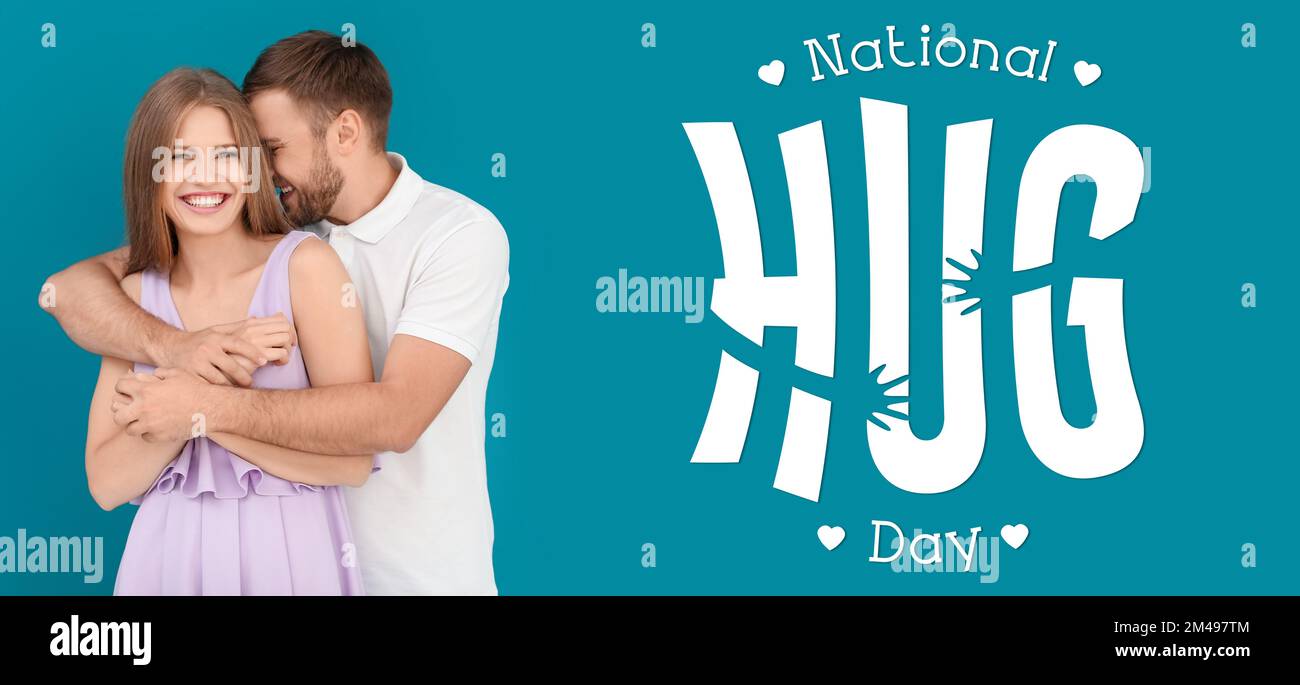 Portrait of hugging young couple on blue background. National Hugging ...