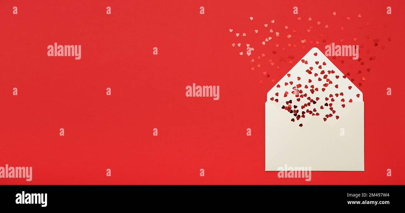 Envelope and many small hearts on red background with space for text ...