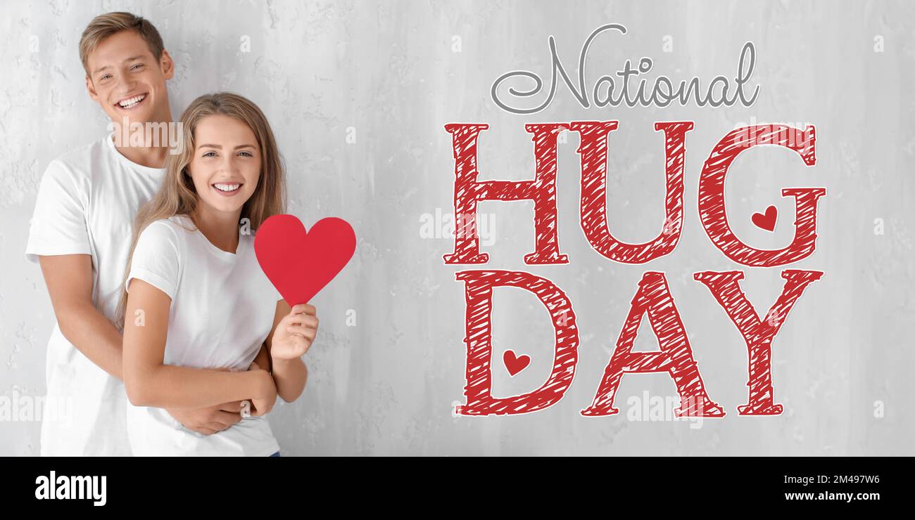 Portrait of hugging young couple on grunge background. National Hugging ...