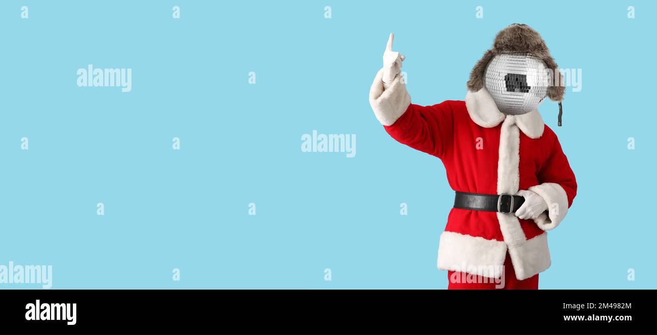 Santa Claus with disco ball instead of his head on light blue ...