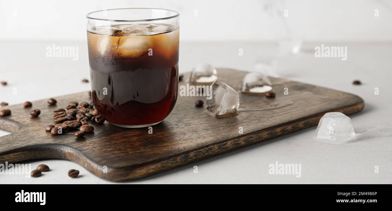 Glass of cold brew coffee on light background Stock Photo - Alamy
