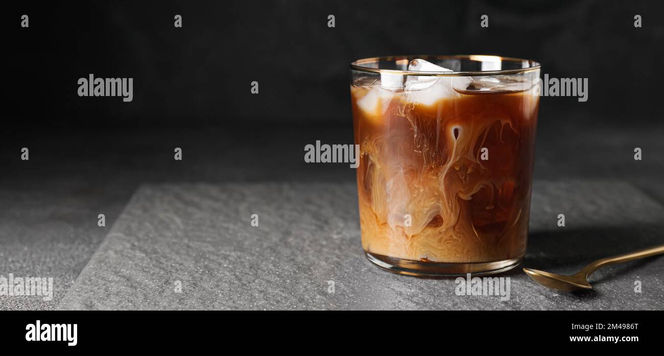 Glass of cold brew coffee on dark background Stock Photo - Alamy